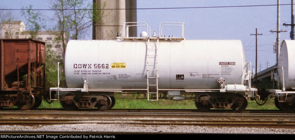DOWX 5662 6-1976 GATX-built 3-1995 repainted caustic soda tank car at the west end of CSX ...